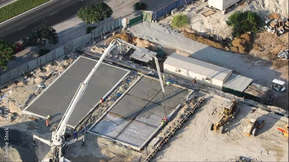 DUBAI, UAE - CIRCA 2022: concrete mixer machinery pouring concrete to ...