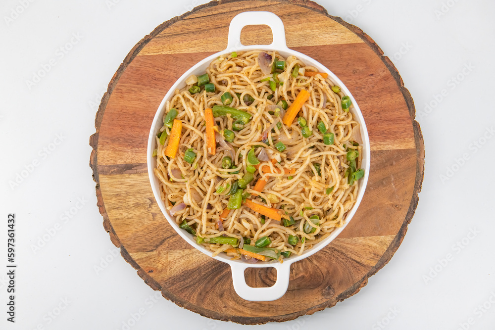Tasty Vegetable hakka noodles in white plate and isolated background ...