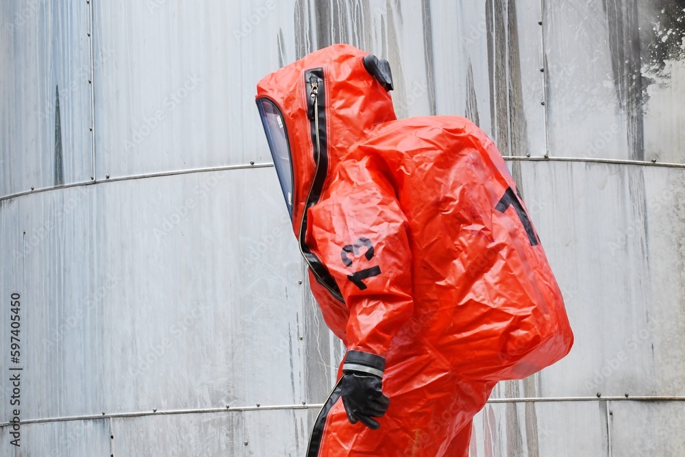 Firefighter in a protective hazmat chemical suit when responding to an ...