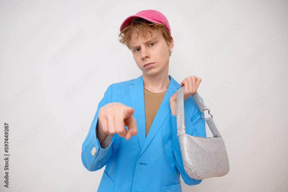 Portrait of angry handsome young gay man pointing index finger at you ...
