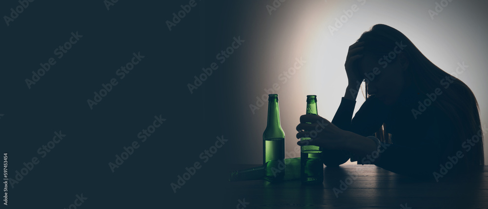 Suffering from hangover. Woman with alcoholic drink at table against ...