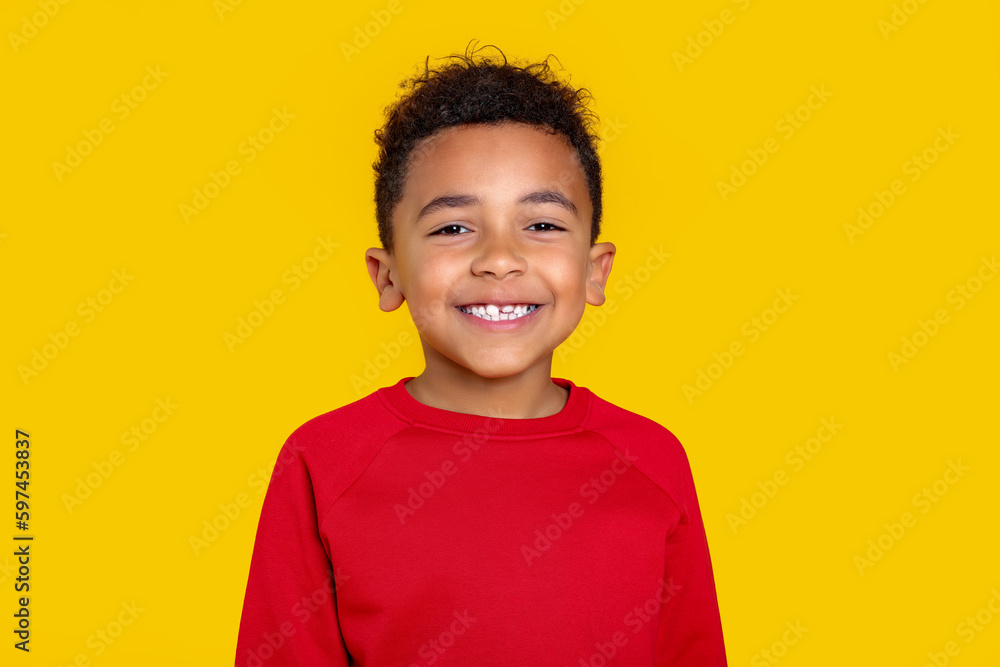 Portrait of cute African-American boy on yellow background Stock Photo ...