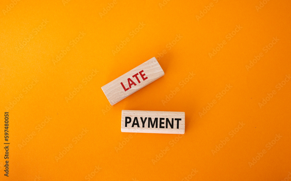 Late payment symbol. Concept word Late payment on wooden blocks ...
