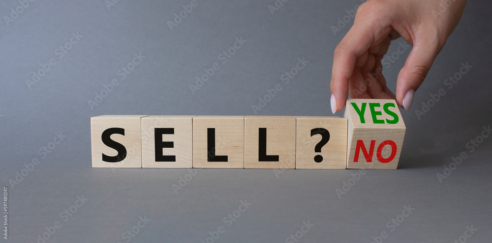 Sell Yes or No symbol. Businessman Hand turns cubes and changes words ...