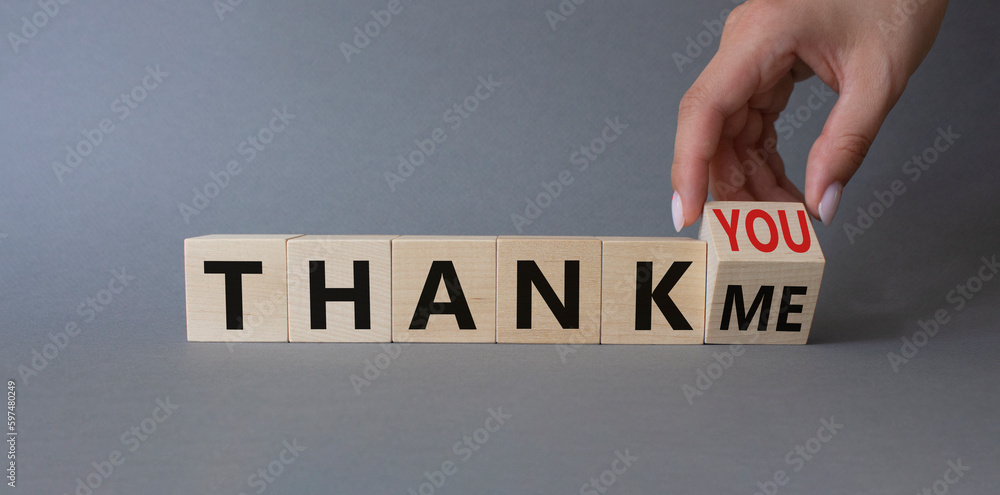 Thank You or Me symbol. Businessman Hand turns cubes and changes words ...