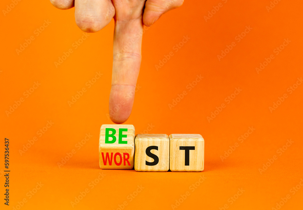 Best or worst symbol. Businessman turns wooden cubes and changes the ...