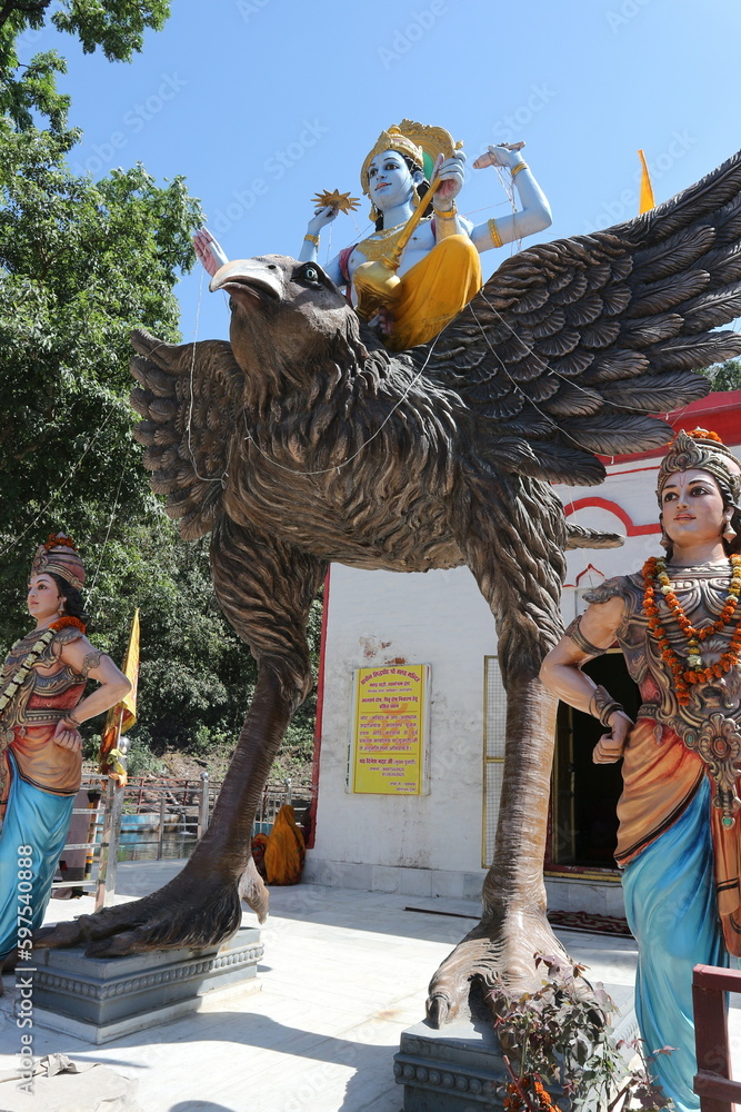 Sculpture of Vishnu seated on Garuda as a gate to a Hindu temple in ...