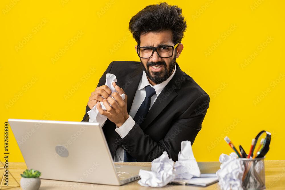 Angry furious indian man working at office throwing crumpled paper ...