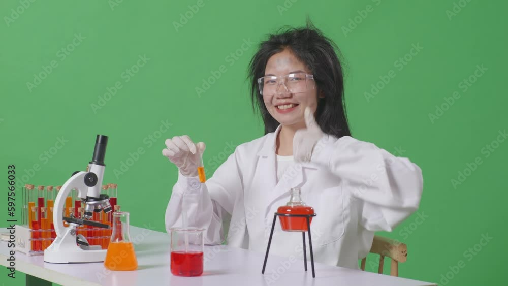 Side View Of Crazy Asian Woman Scientist Looks At Test Tube Smiling And ...