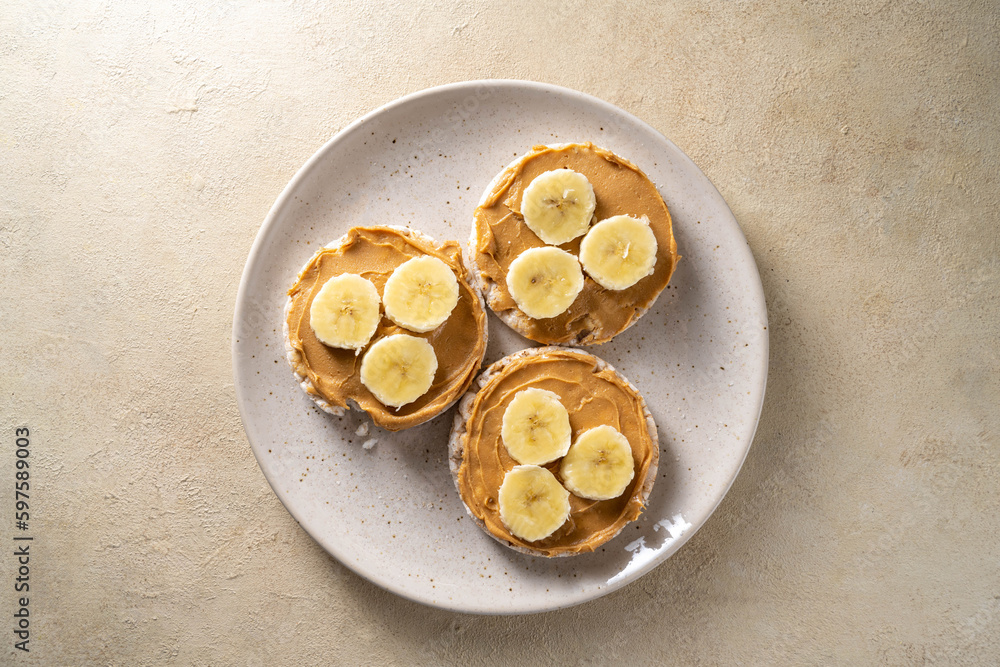 Rice cakes with banana and peanut butter, healthy protein snack Stock ...