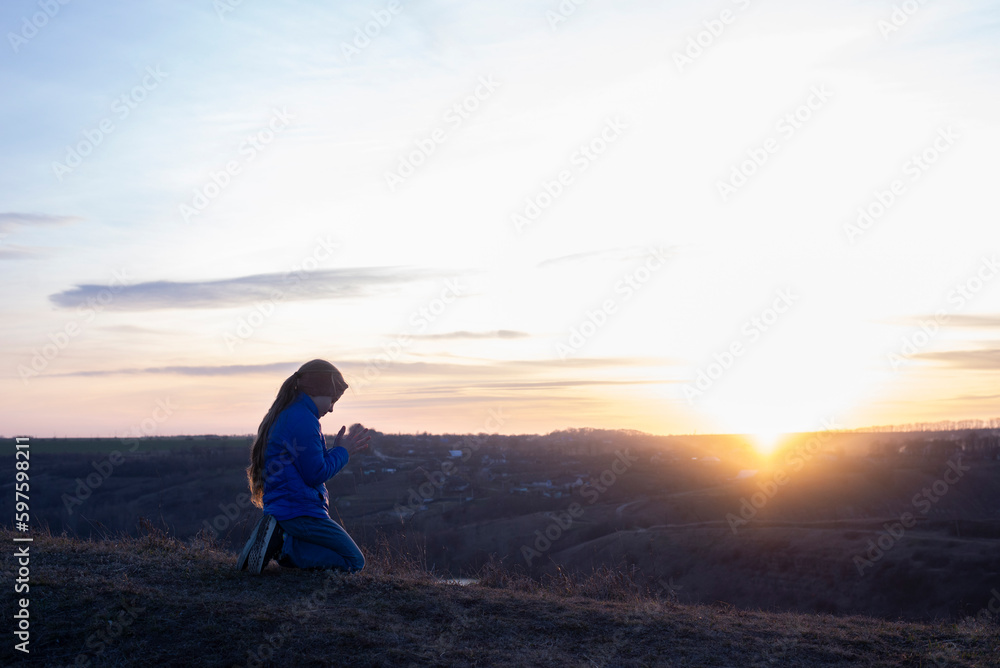 Prayer. The girl is kneeling and praying. Kneeling Repentance for sins ...