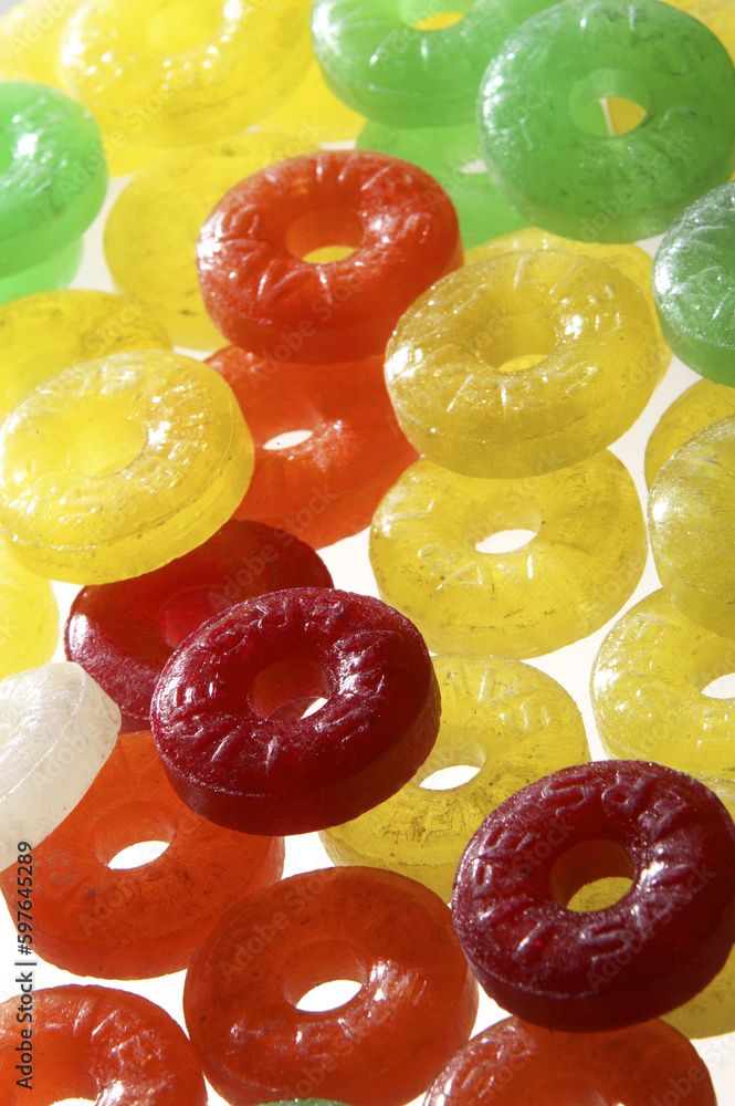 Lifesaver candies floating through air in a vivid rainbow of colors ...