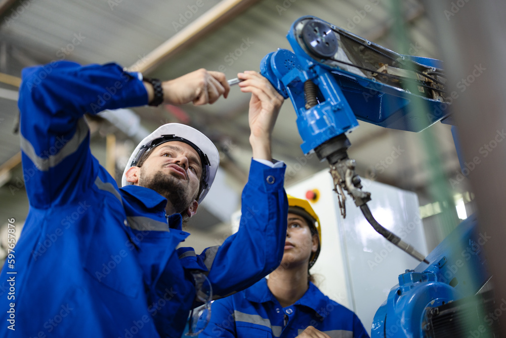 Robotic technicians tighten and loosen components with screwdriver and ...