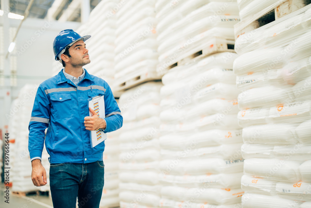 Smart engineer man worker wearing safety helmet doing stocktaking of ...