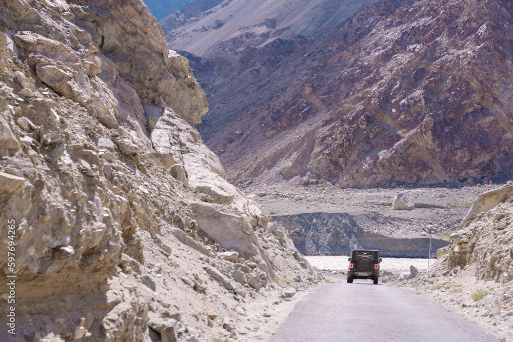 the car crossed the mountain road on the way to pangong lake, Leh ...