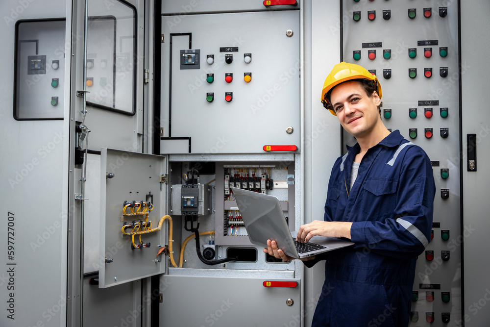 Electrical engineer working in control room. Electrical engineer man ...
