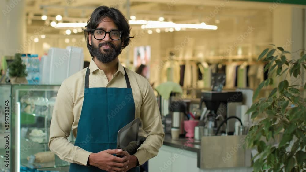 Indian male coffee store worker Arabian waiter Muslim man startup owner ...