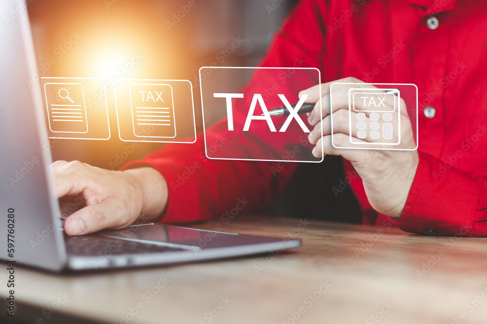 e-tax Invoice concept woman's hand is cube wood building a including ...