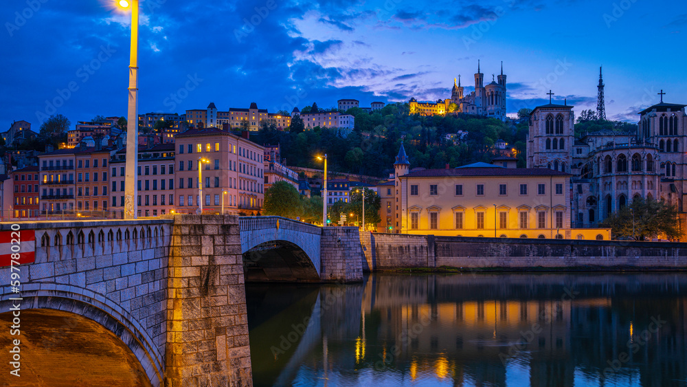 Lyon city skyline at night, over the Pont Bonaparte Bridge, vibrant ...