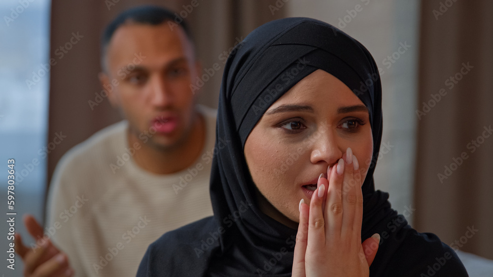 Couple quarrel sad crying muslim woman wife sit on couch screaming ...