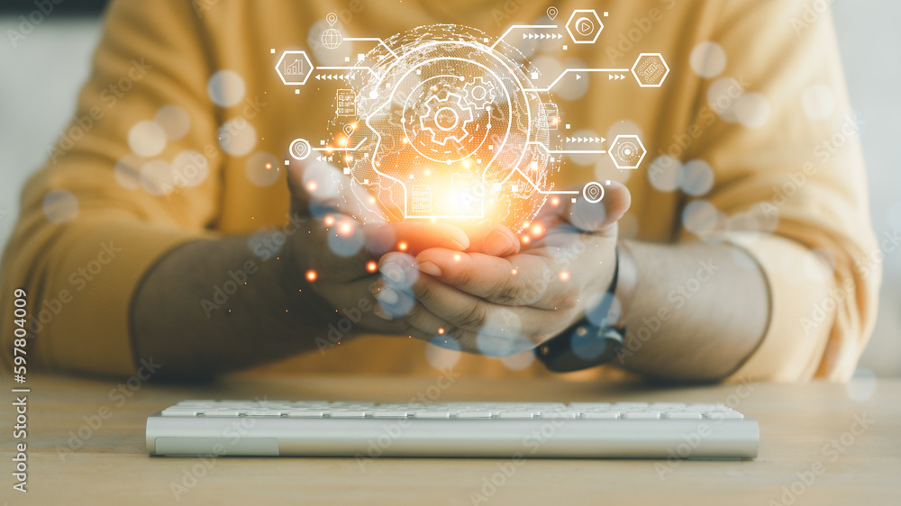 Man holding global network and brain icons with the idea of e-learning ...