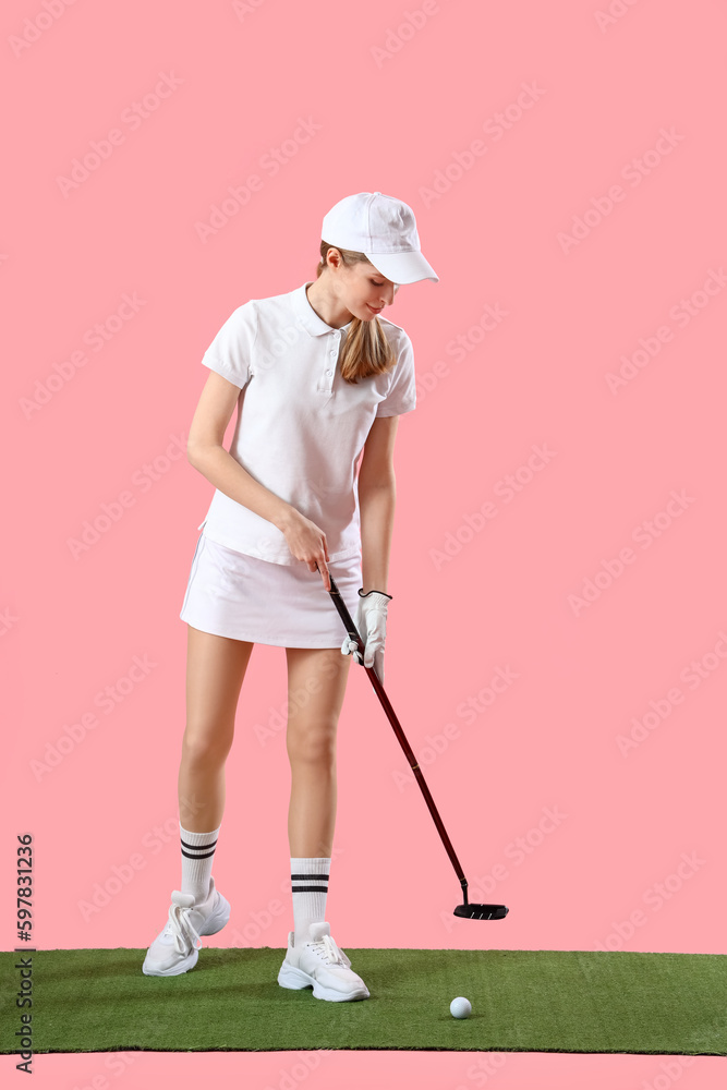 Young woman playing golf on pink background Stock Photo | Adobe Stock