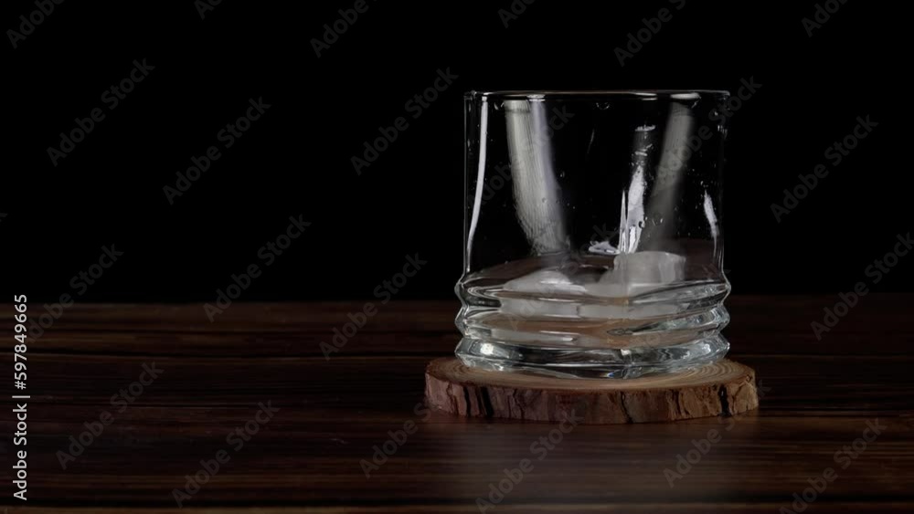 throwing ice cubes in glass -black background (4k - slow motion)[ high ...
