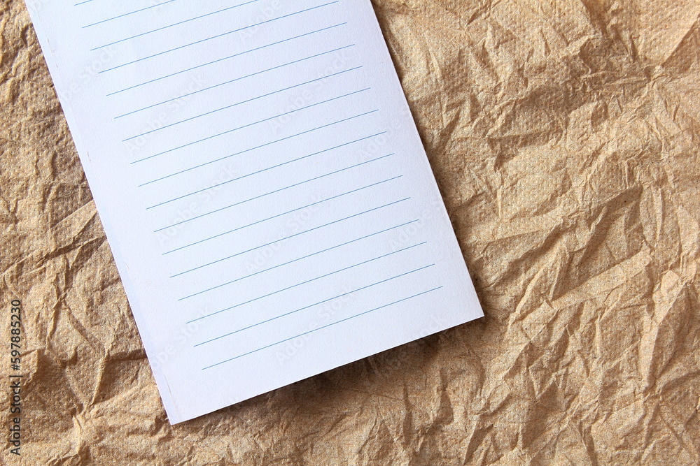 white note paper sheets on brown wrinkled crumpled paper texture ...