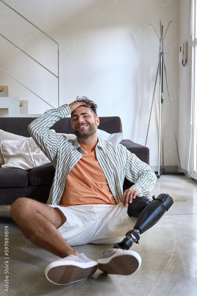 Happy young relaxed man amputee with prosthetic leg disability above ...