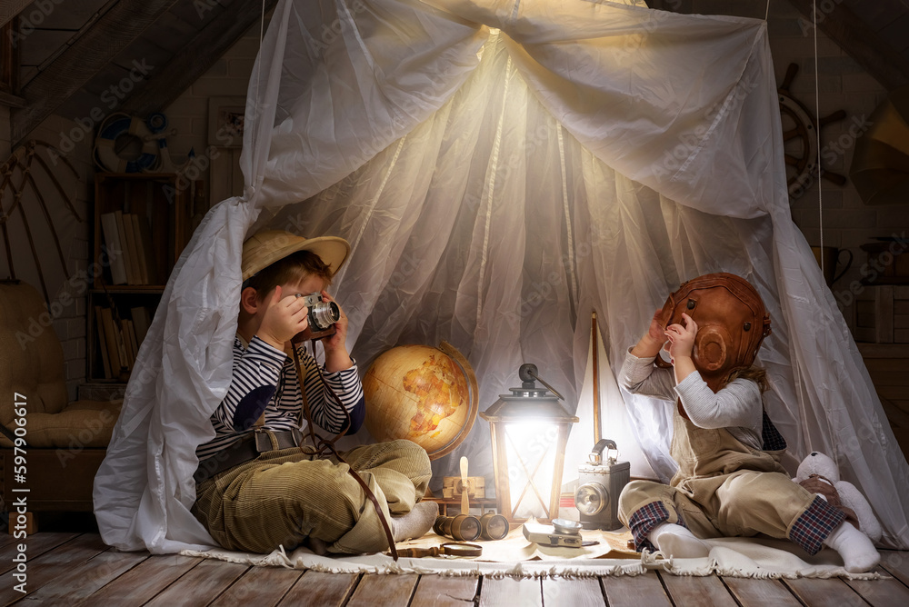 Children play in the attic of their house. Imagine themselves as ...