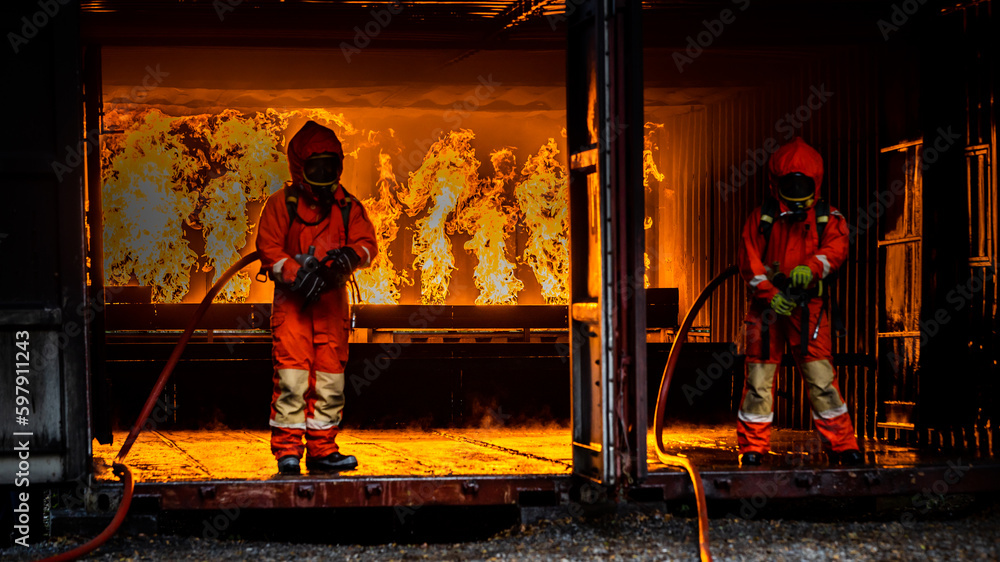 Firefighter Concept. Fireman using water and extinguisher to fighting ...