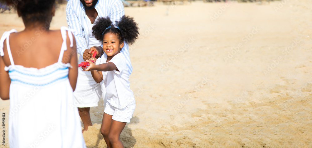 Stockfoto Black family having fun on the beach. mixed race family ...