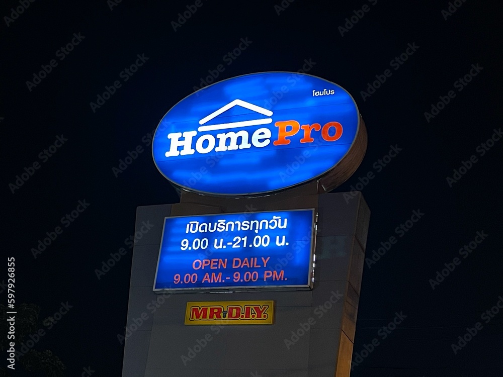 Bright glowing box with HomePro store logo and hours of operation on ...