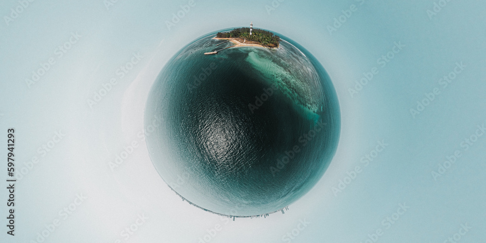 A perfect blue sphere island sits in a studio, isolated against the ...
