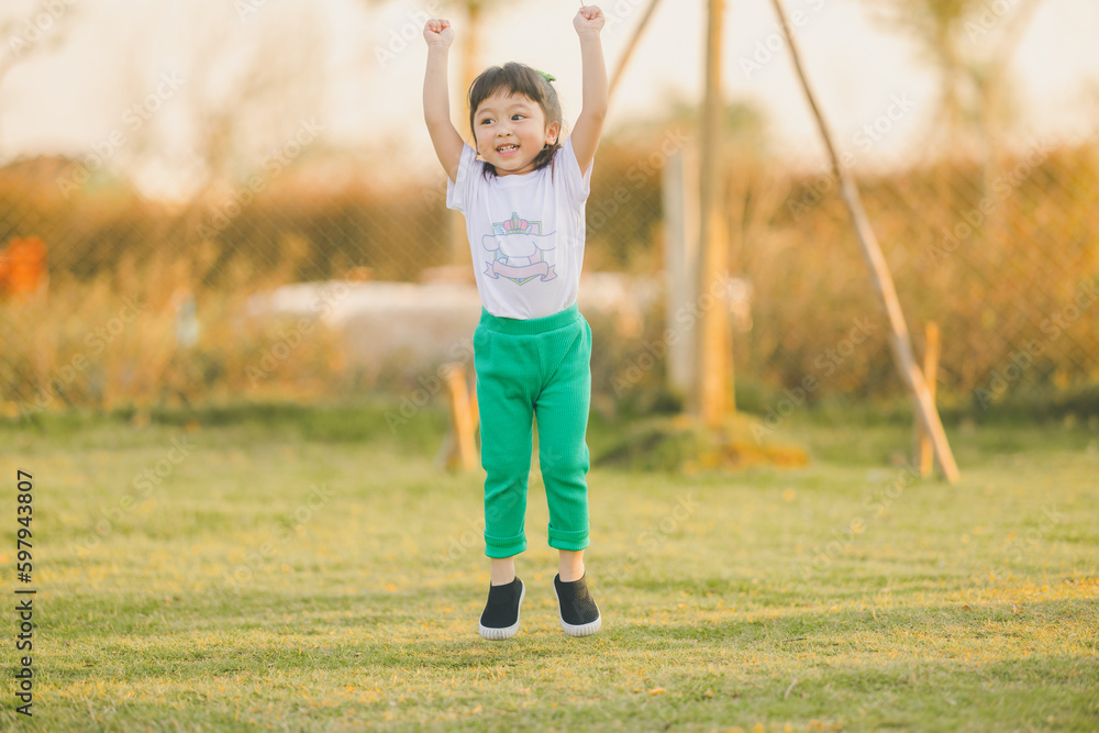 Freedom style of asia baby cute girl Jump play on a the outdoor ...