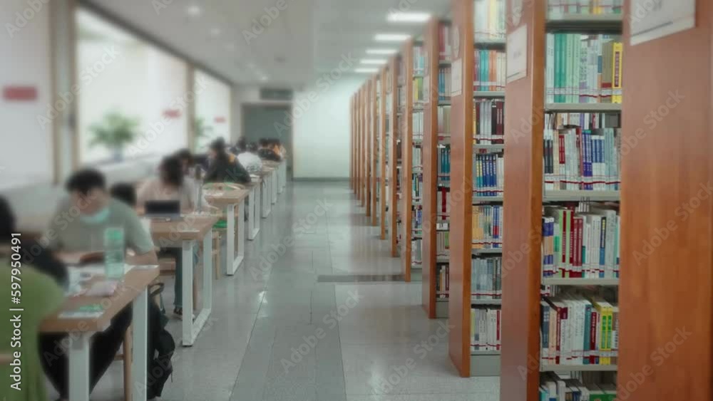 Bookshelves in modern university library with shelves full of books ...