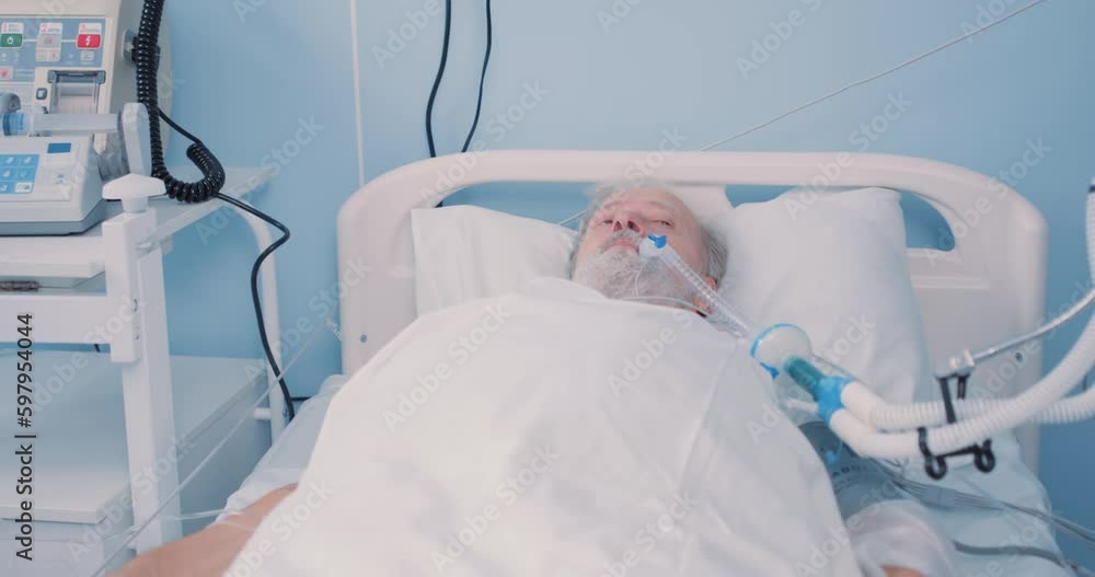 Sick ol patient has blood transfusion in hospital, patient with tube in ...