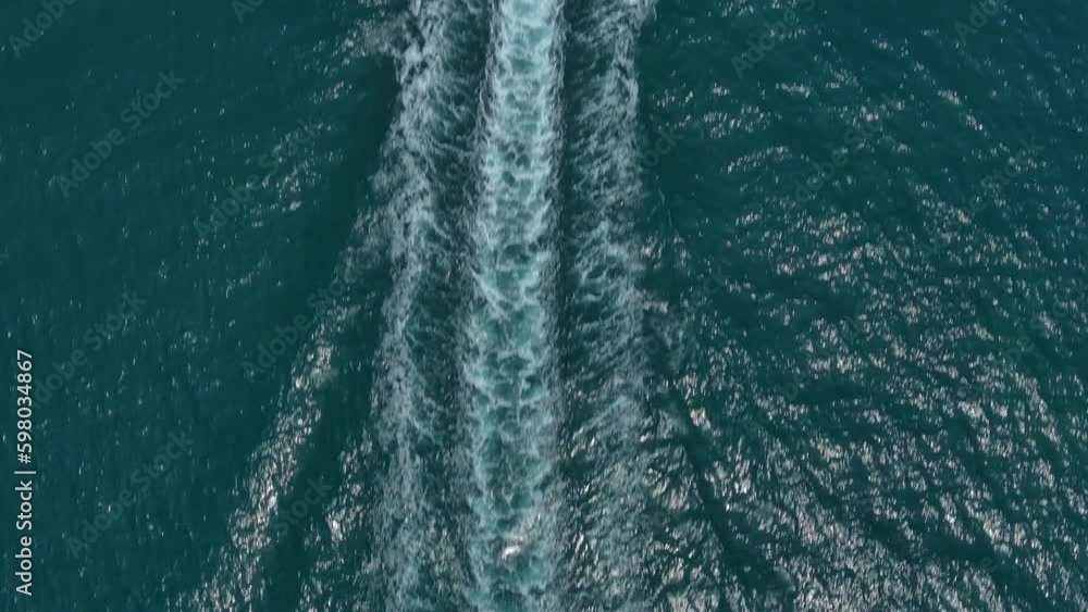 Drone film of large speed boat - Drone comes from behind the boat ...