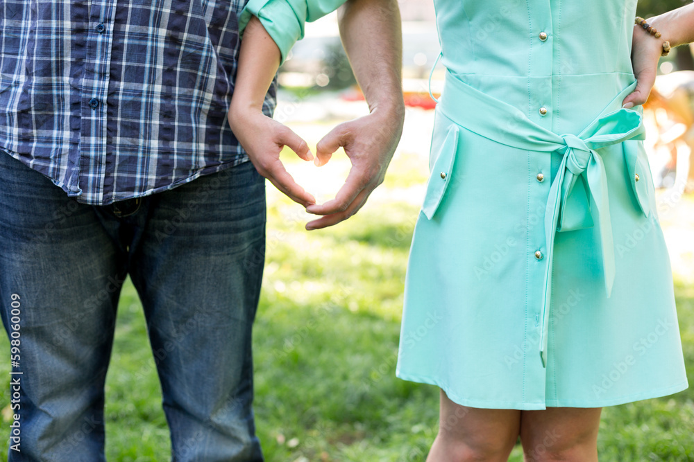 Foto de heart hands of husband and wife, couple in love, family. hands ...