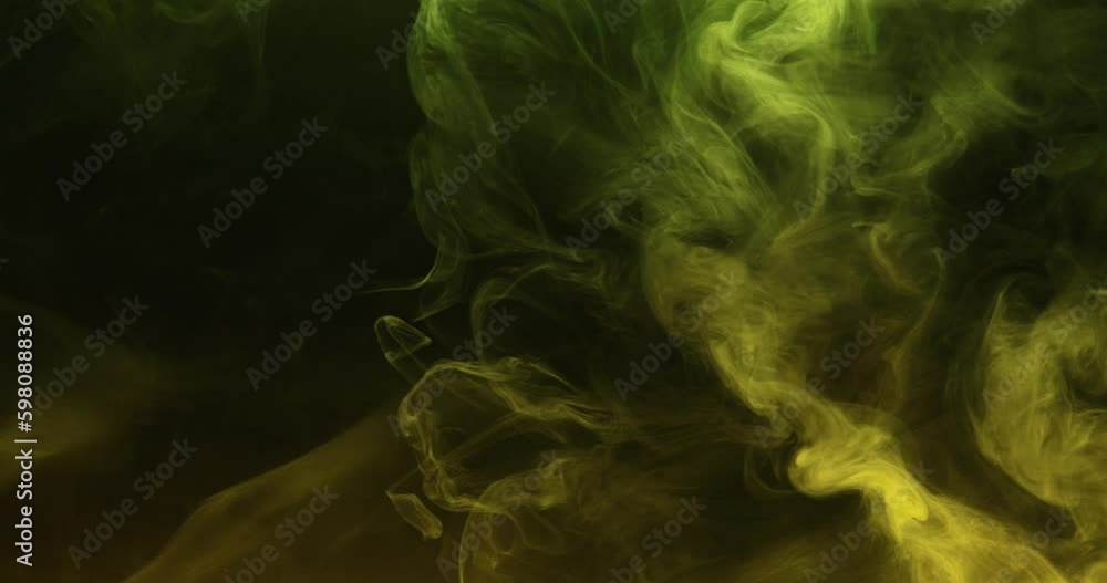 Vidéo Stock Colored smoke moves beautifully against a black background ...