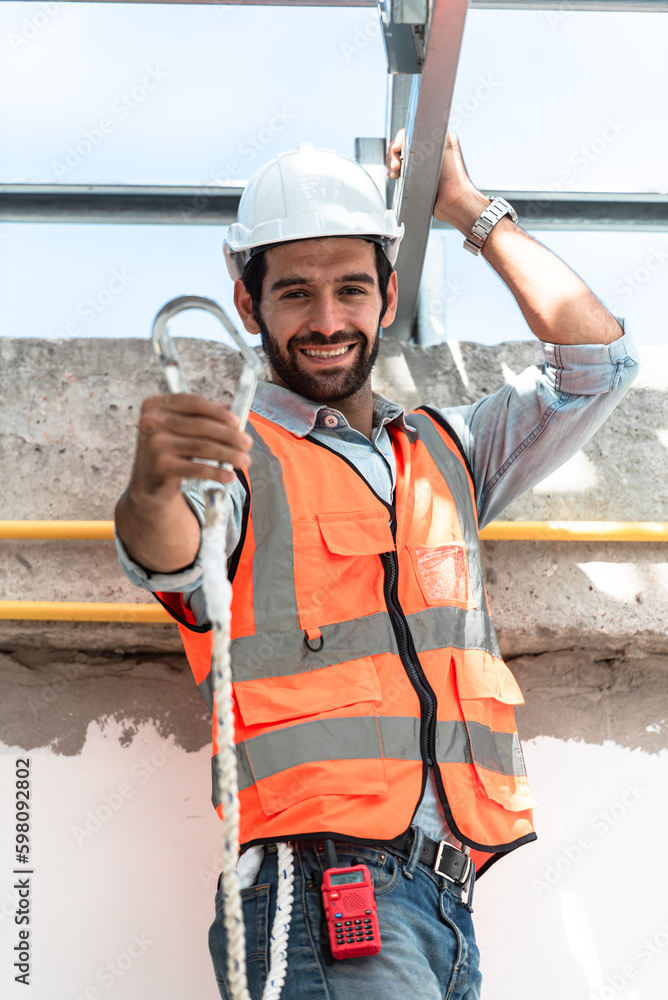 Construction worker men wearing safety sling climbing belt and hardhat ...