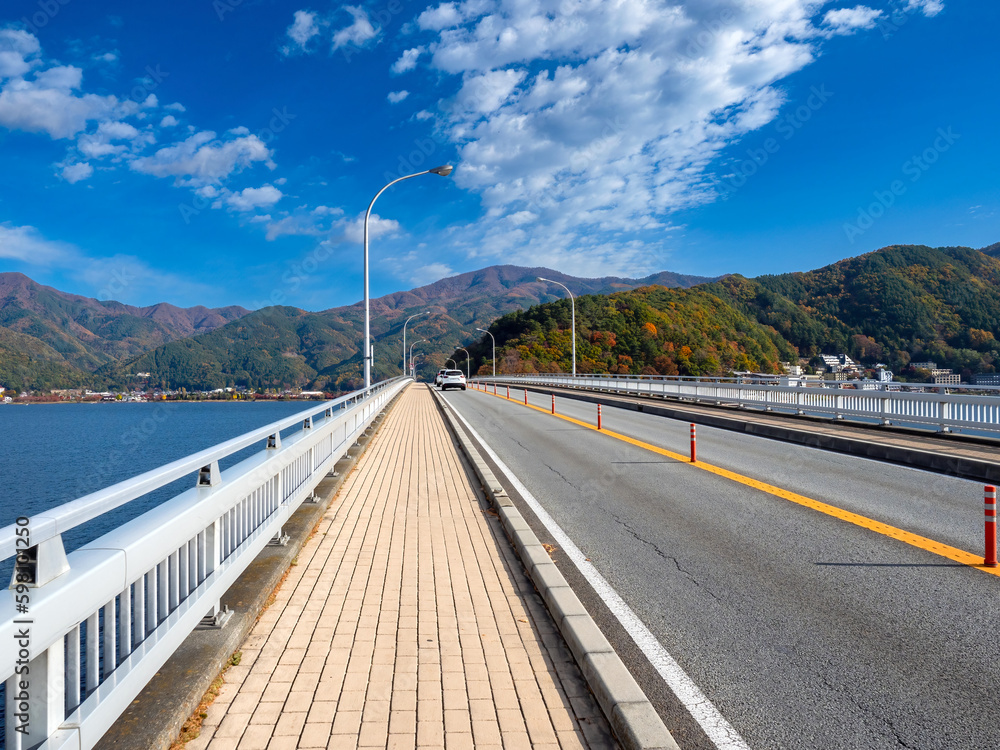 Regions of Japan. Bridge over lake Kawaguchiko. Road bridge under blue ...