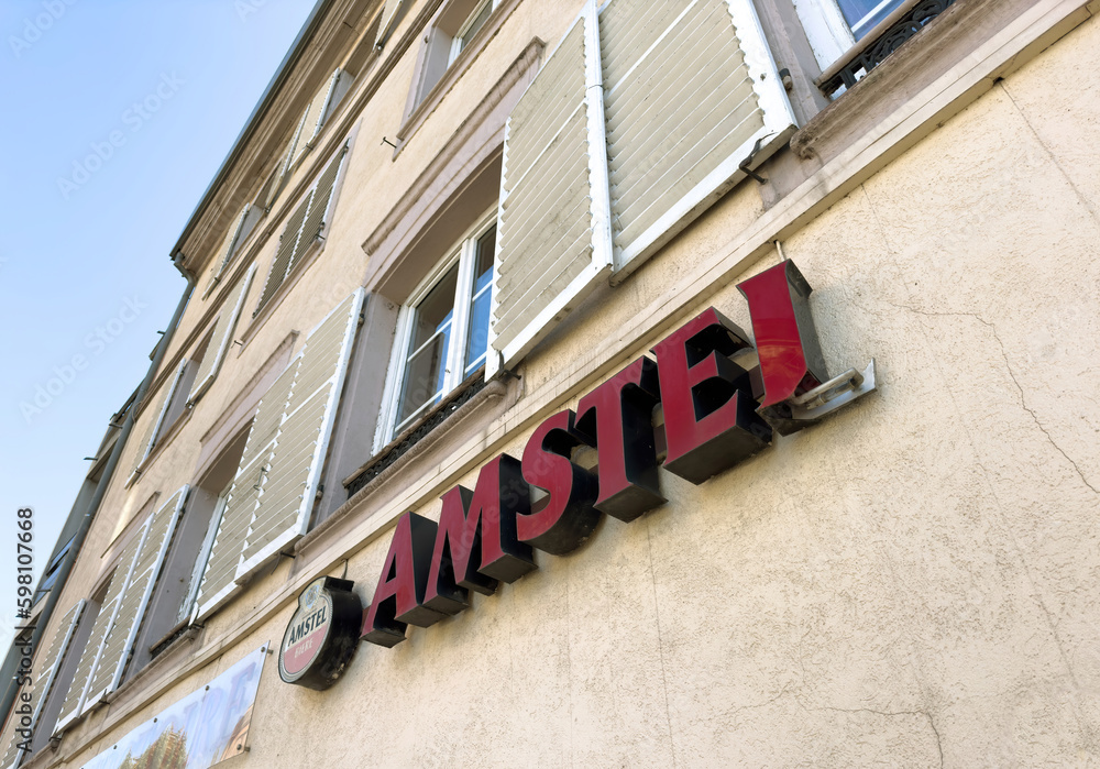 Strasbourg, France - Sep 21, 2022: A vibrant red neon sign illuminates ...