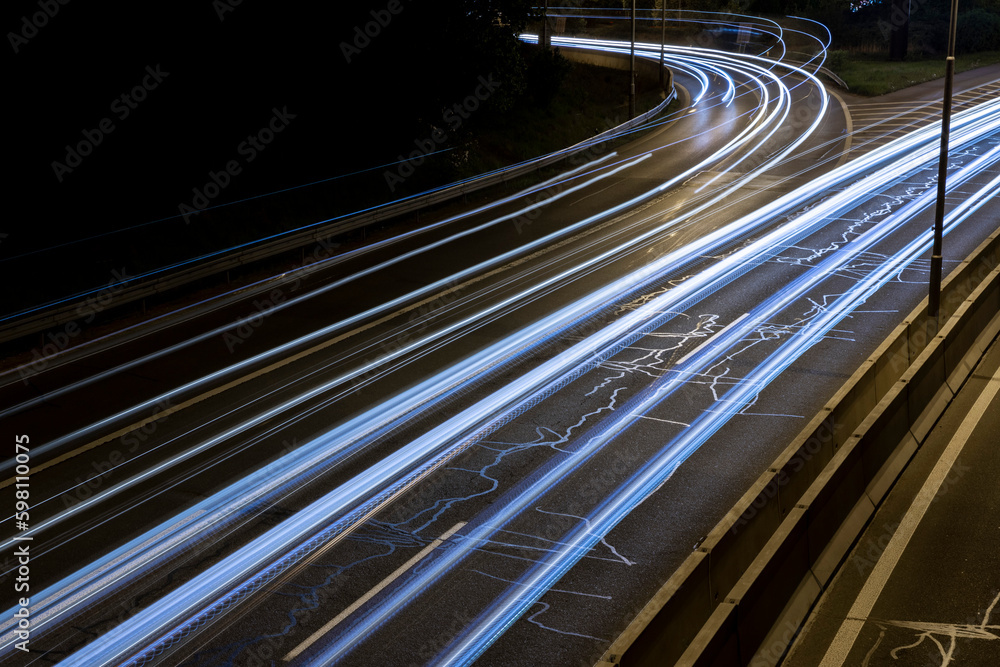 Lightlines of car headlights captured by long exposure. Motorway in the ...
