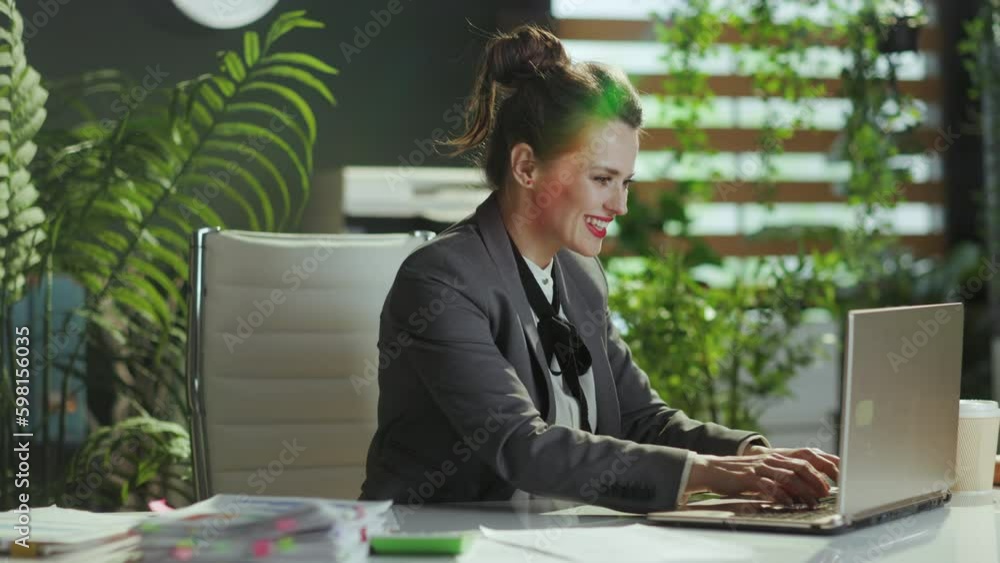 Sustainable workplace. smiling modern 40 years old bookkeeper woman in ...