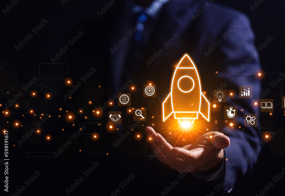 hand shows a rocket and an icon. Concept of Startup Business ...