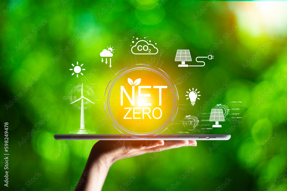 net zero concept. Hand holding with net zero icon on blur green leaf ...