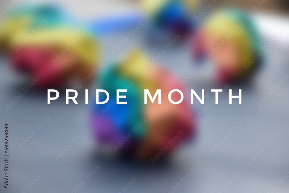 pride month with blurred rainbow paper ball background, concept for ...