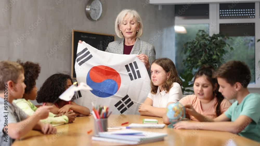 Kids learning together about south korea in geography class Female ...