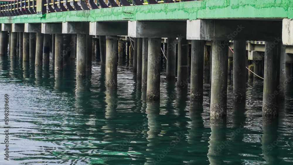 Bridge foundation pillars in the sea or concrete pillars of a pier from ...